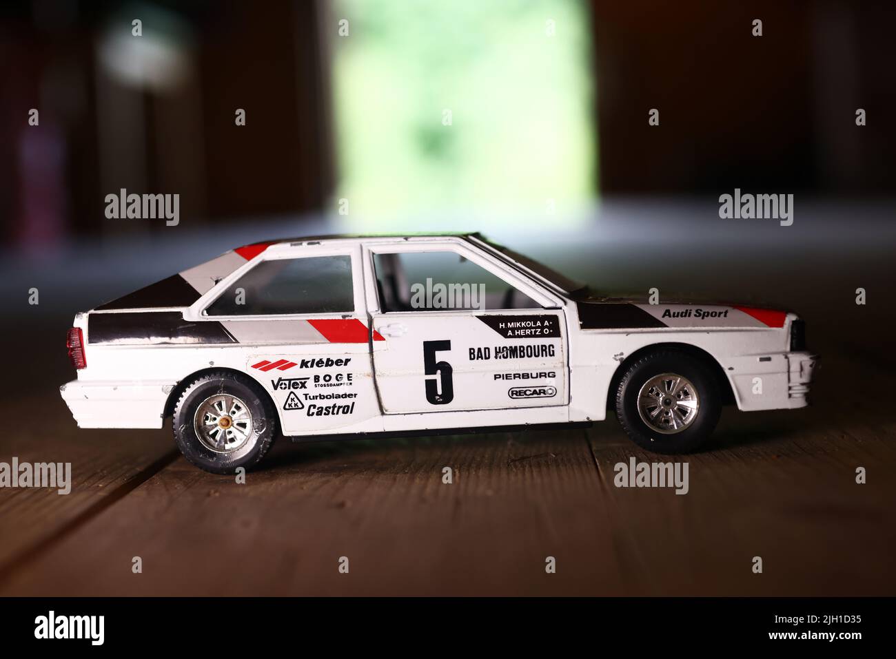 Toys in a box in an attic of a house. Here are small toy cars, a Audi ...