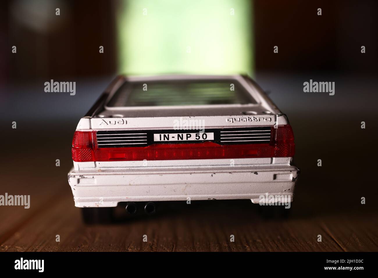 Toys in a box in an attic of a house. Here are small toy cars, a Audi ...