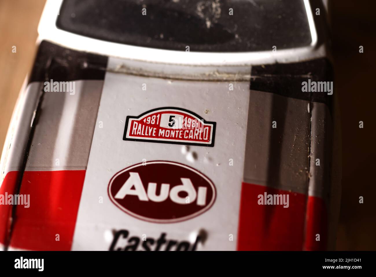 Toys in a box in an attic of a house. Here are small toy cars, a Audi ...