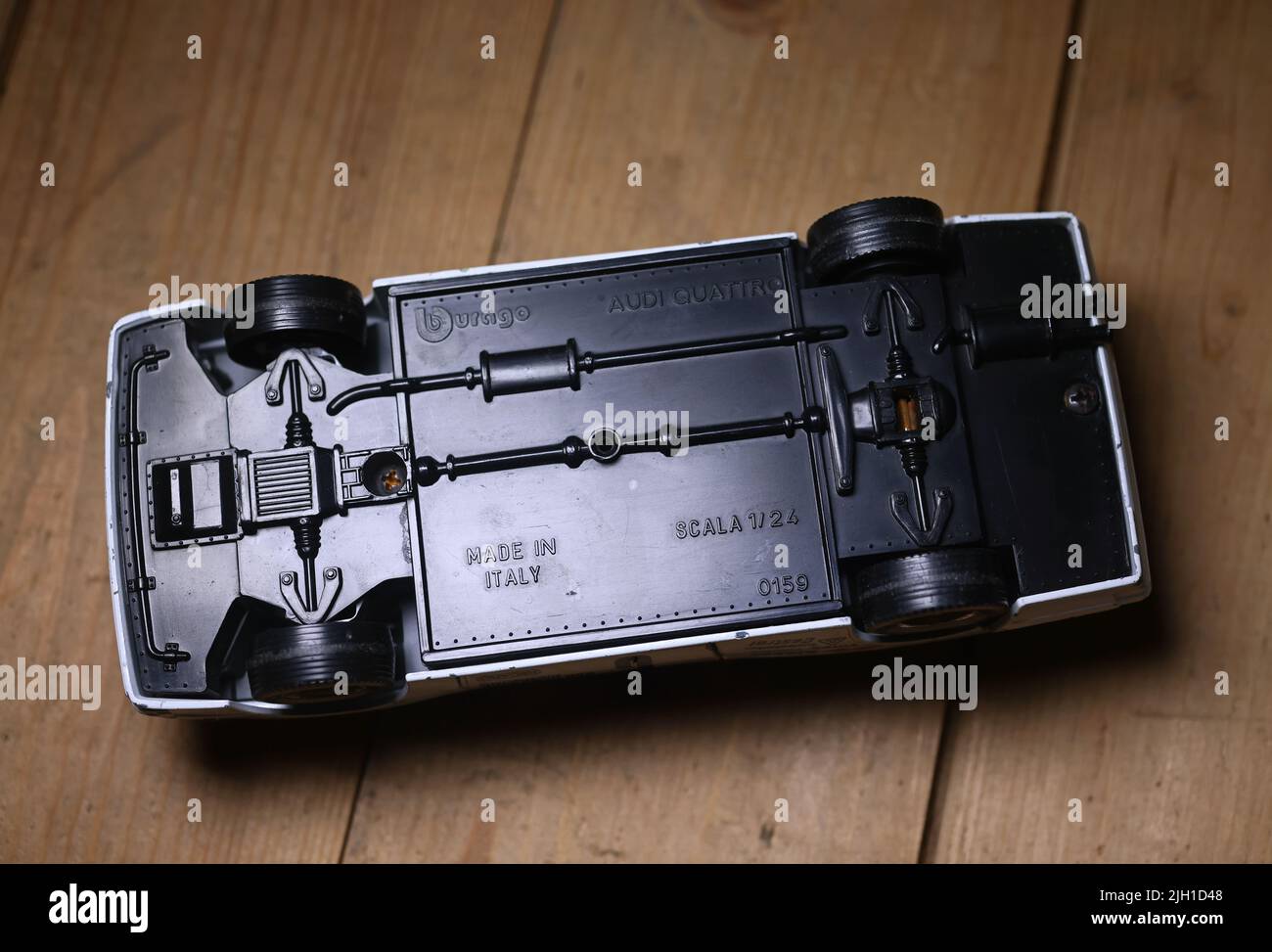 Toys in a box in an attic of a house. Here are small toy cars, a Audi ...