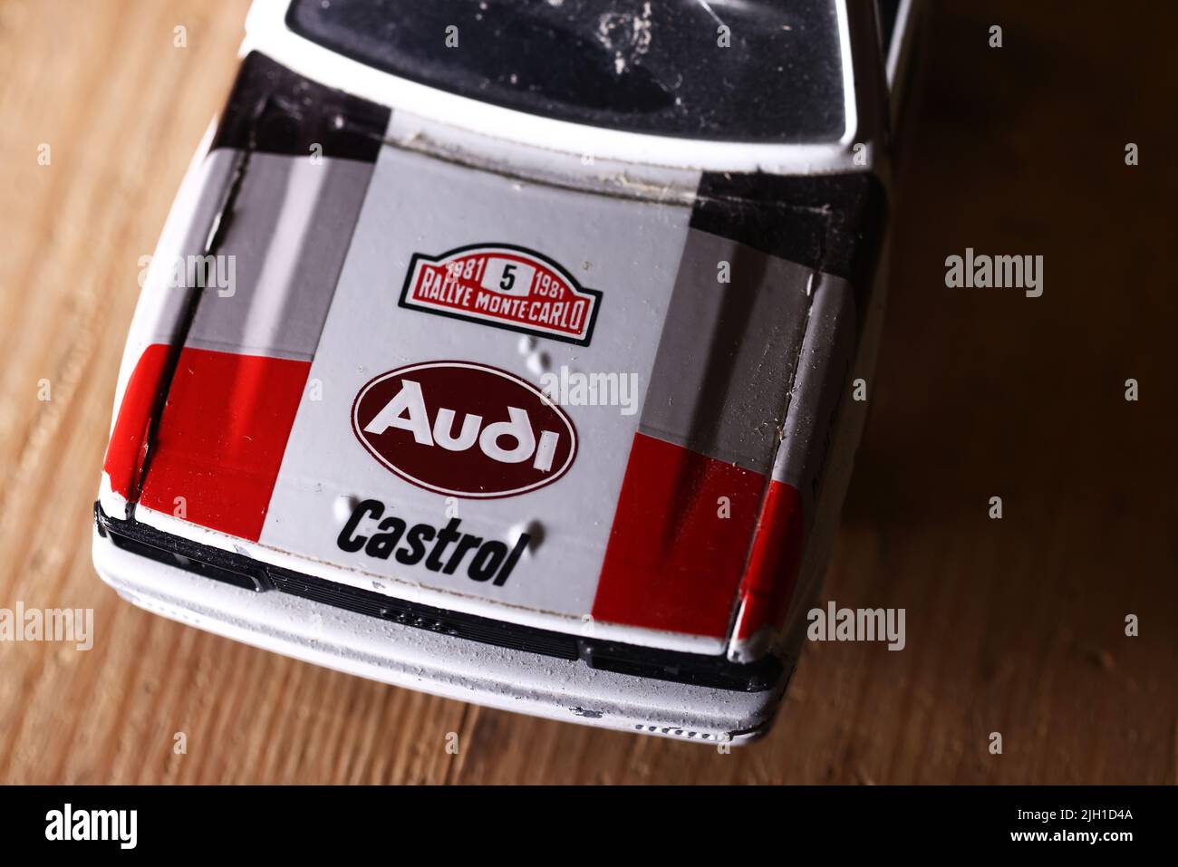 Toys in a box in an attic of a house. Here are small toy cars, a Audi ...
