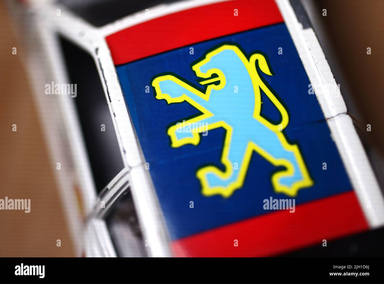 Toys in a box in an attic of a house. Here are small toy cars, a ...