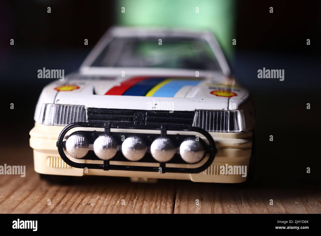 Toys in a box in an attic of a house. Here are small toy cars, a ...