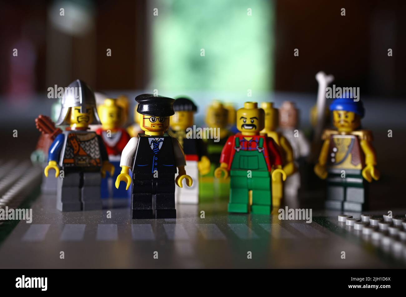 Toys in a box in an attic of a house. Lego, a line of plastic ...