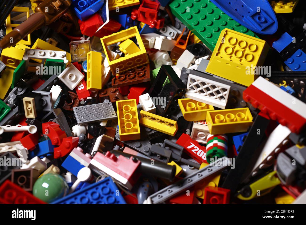 Toys in a box in an attic of a house. Lego, a line of plastic ...
