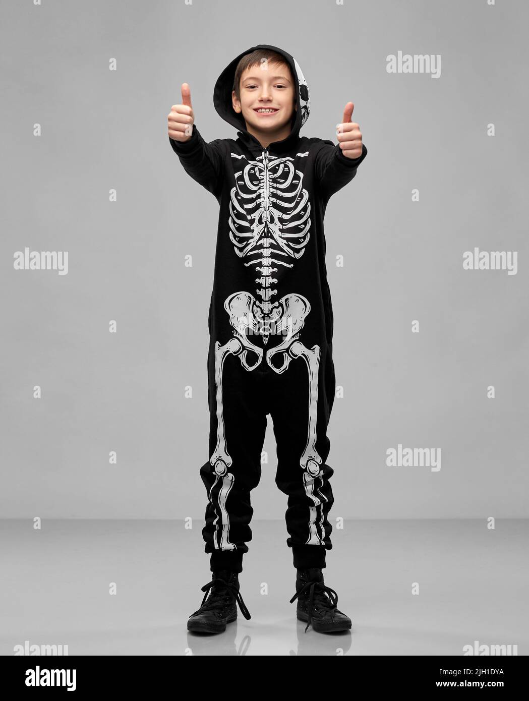 boy in costume of skeleton showing thumbs up Stock Photo - Alamy