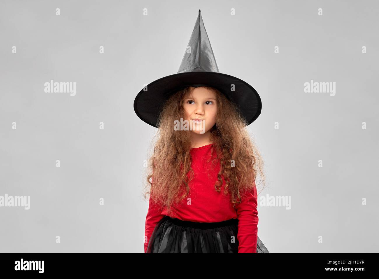 girl in black witch hat on halloween Stock Photo - Alamy