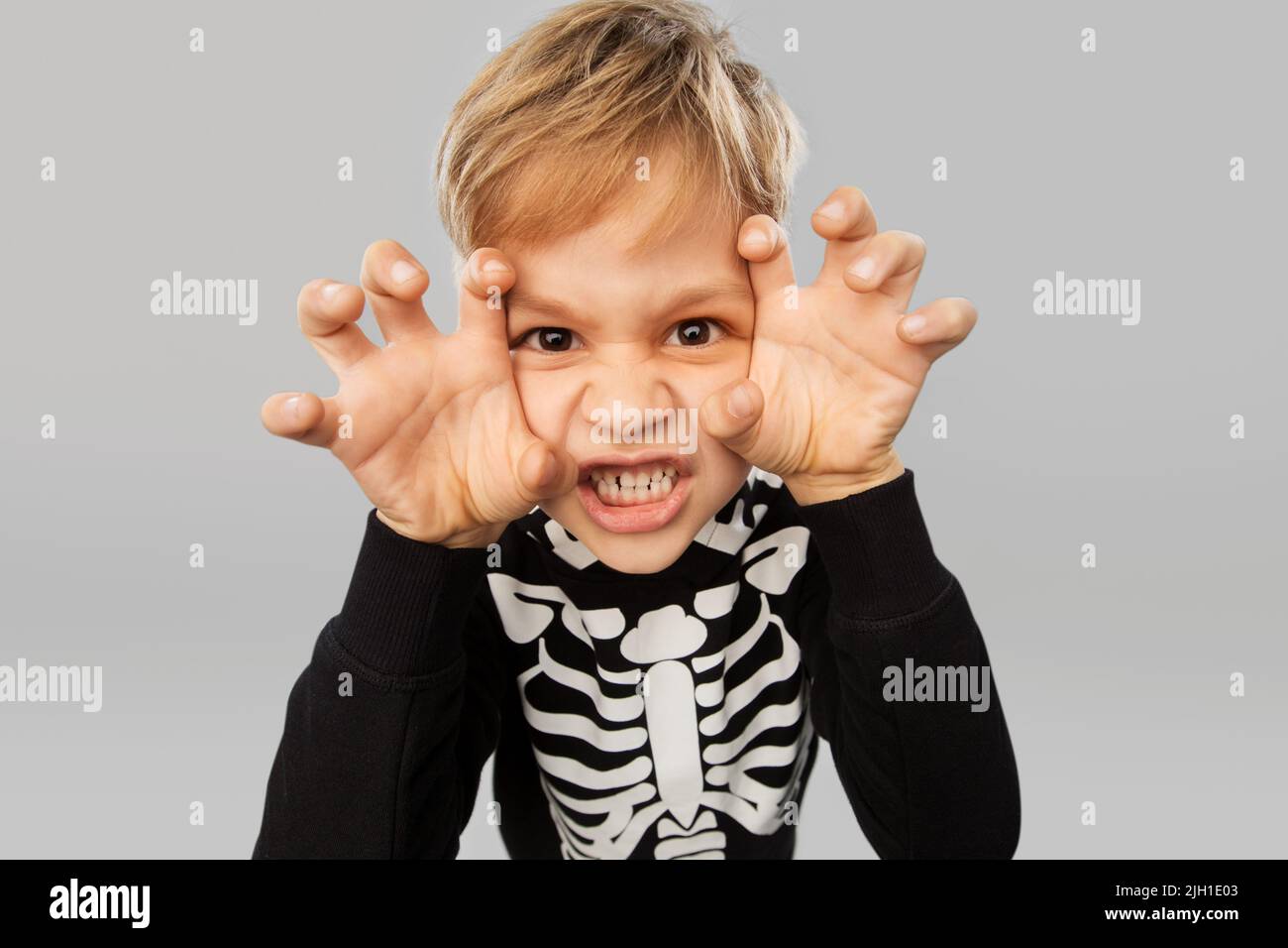 boy in halloween costume of skeleton making faces Stock Photo - Alamy