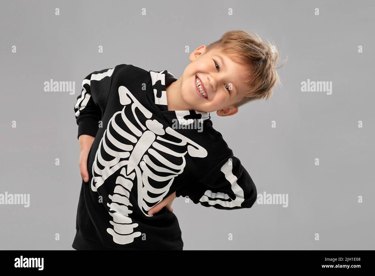 boy in black halloween costume with skeleton bones Stock Photo - Alamy