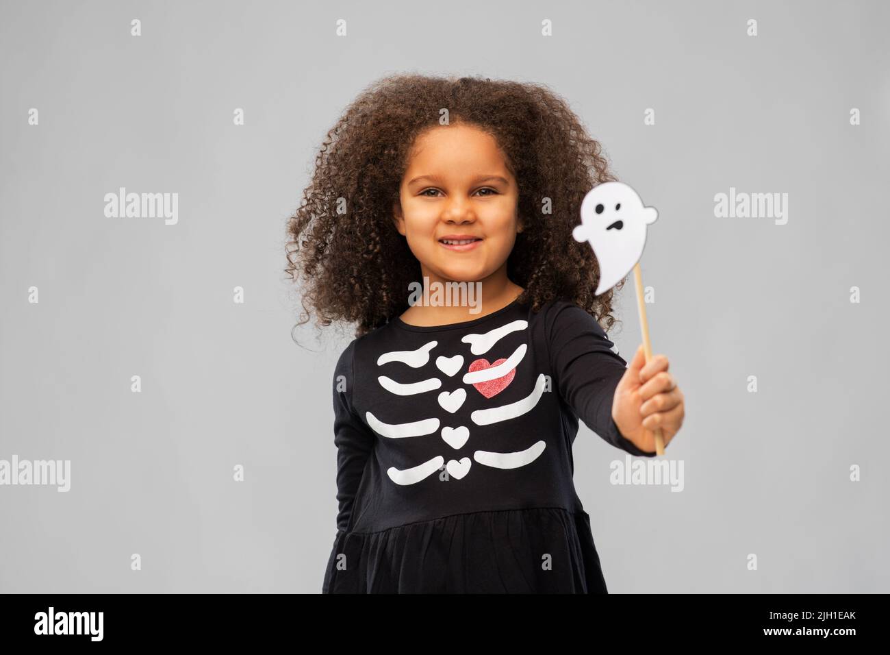 girl in black halloween dress with skeleton bones Stock Photo - Alamy