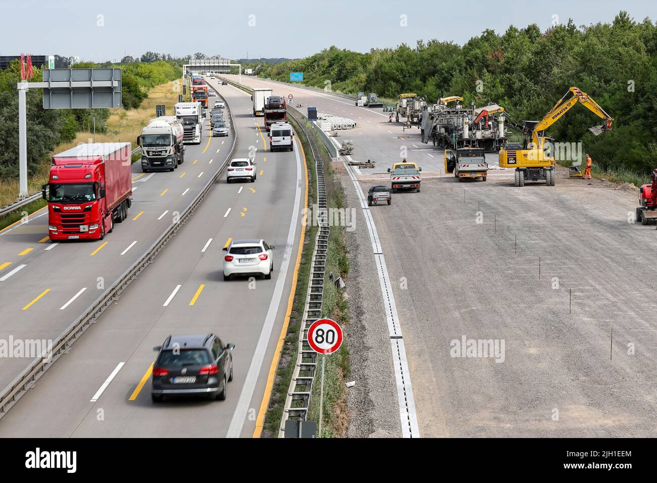 14 July 2022, Saxony, Wiedemar: Cars drive through a highway ...