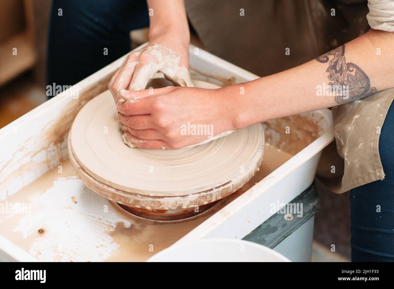 Potter molds on potters wheel close-up. Extreme closeup picture of ...