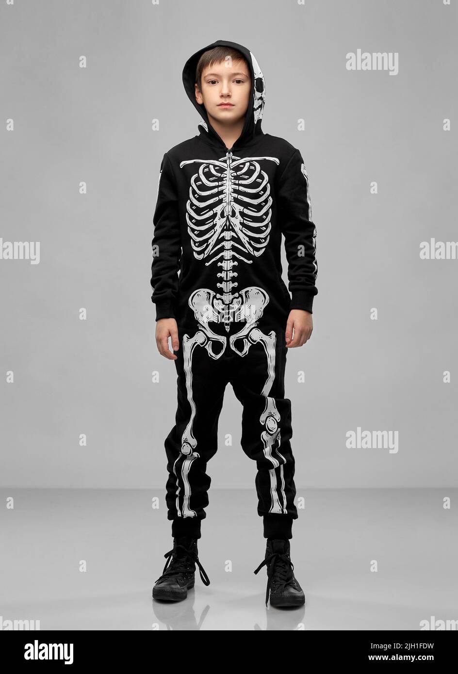 boy in black halloween costume with skeleton bones Stock Photo - Alamy