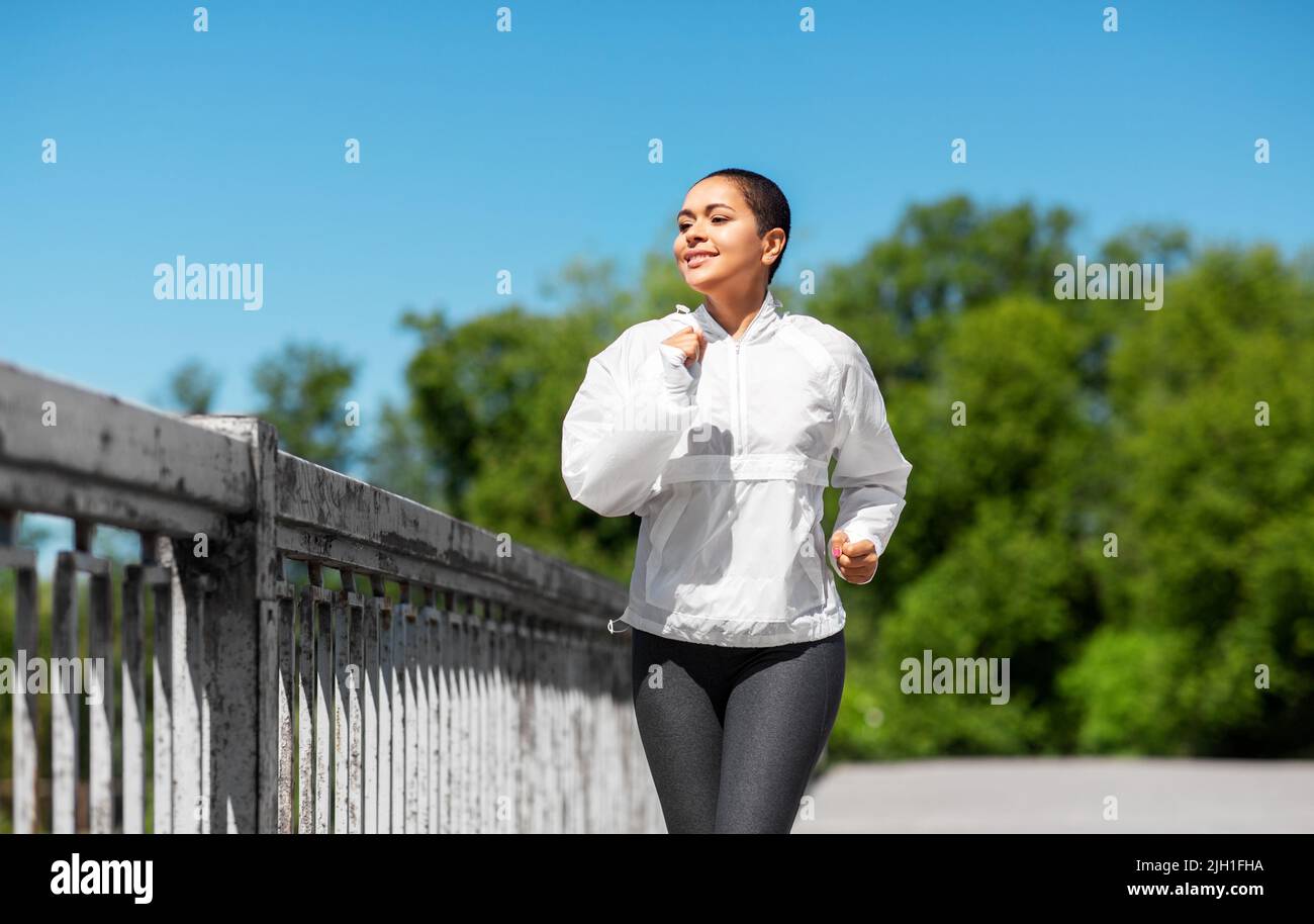 African american woman running hi-res stock photography and images - Alamy