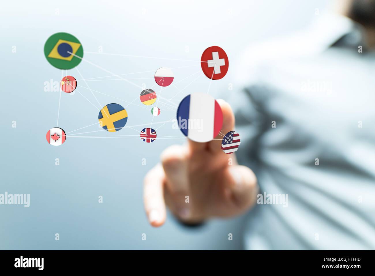 A 3D render of connected world flags near a hand Stock Photo - Alamy
