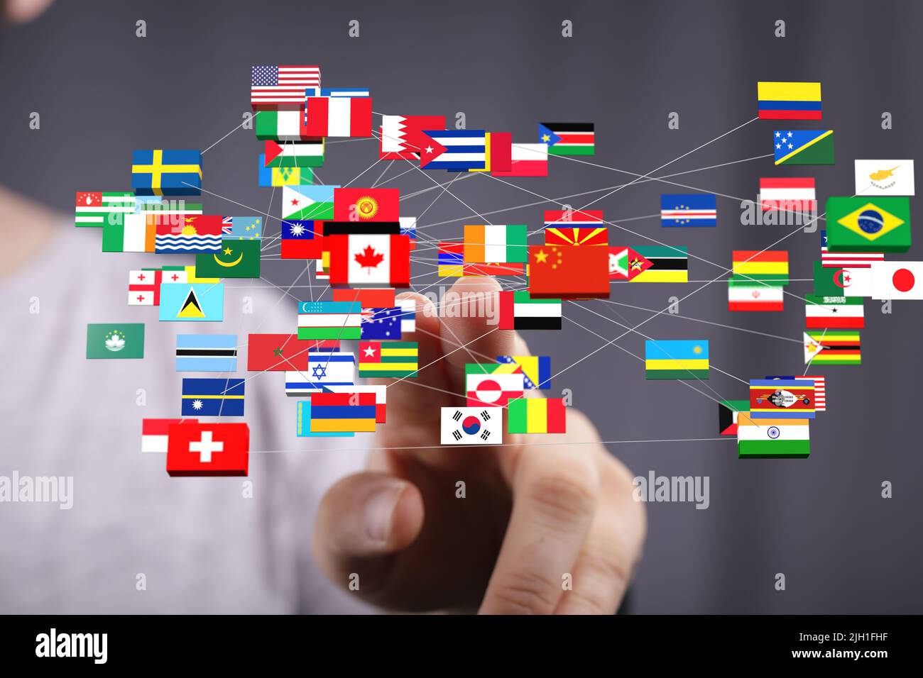 A 3D render of connected world flags near a hand Stock Photo - Alamy
