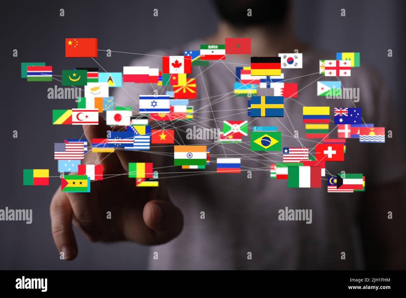 A 3D render of connected world flags near a hand Stock Photo - Alamy