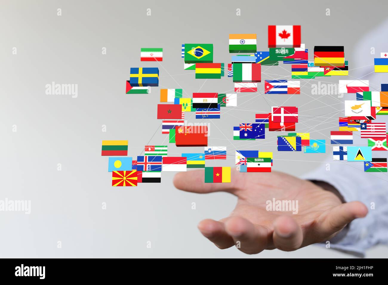 A 3D render of connected world flags near a hand Stock Photo - Alamy