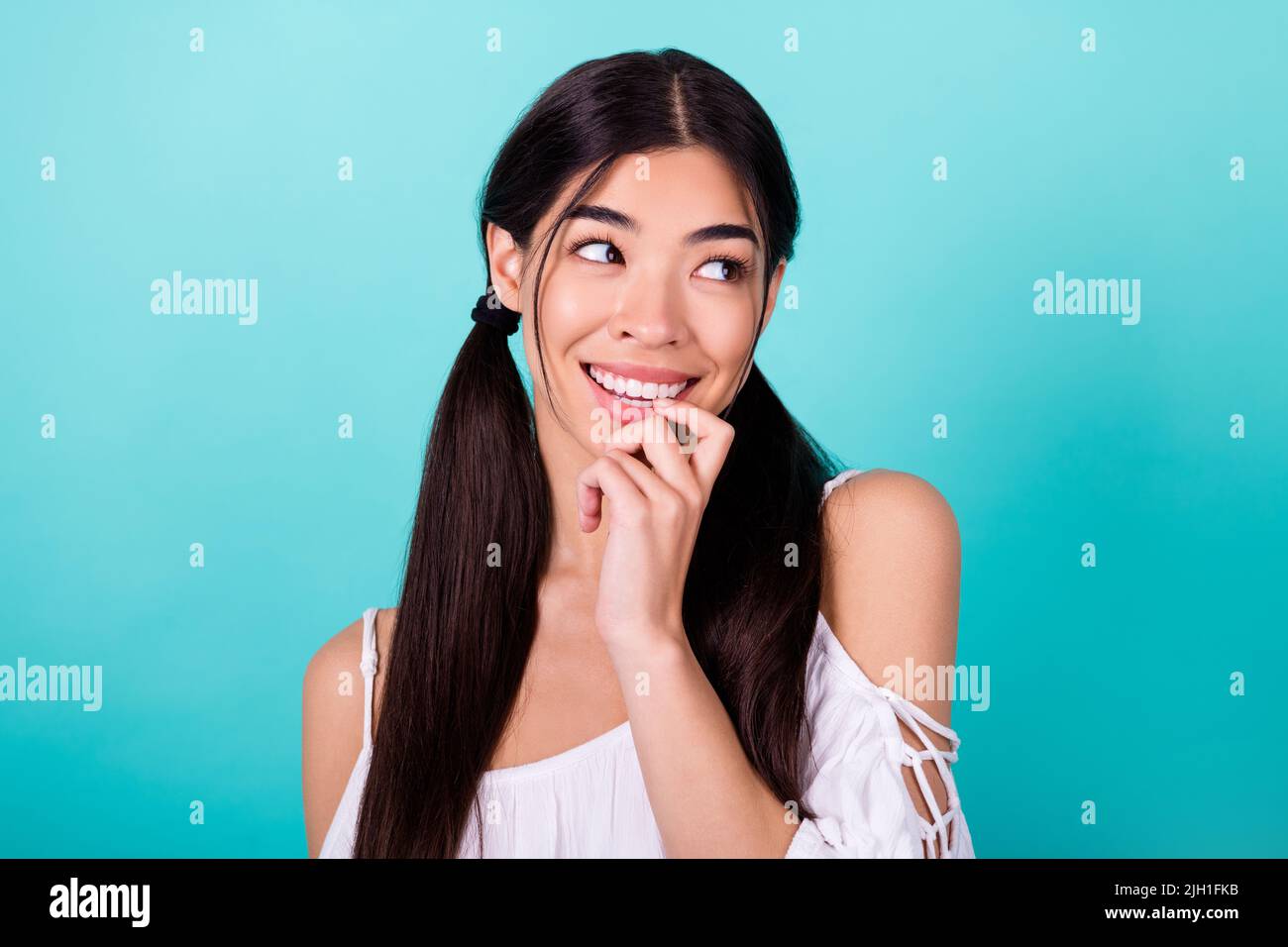 Photo of sweet charming lady wear white top looking empty space finger ...