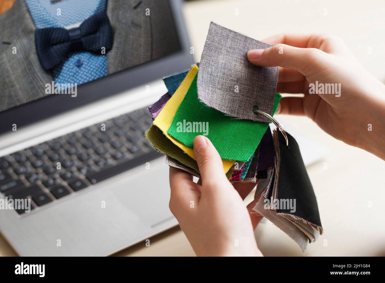 Hands of female designer in office working with colour samples. Woman ...