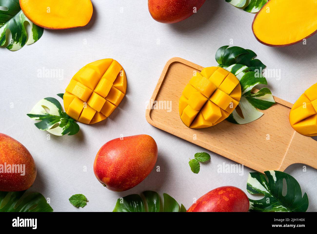Mango background design concept. Top view of diced fresh mango fruit ...