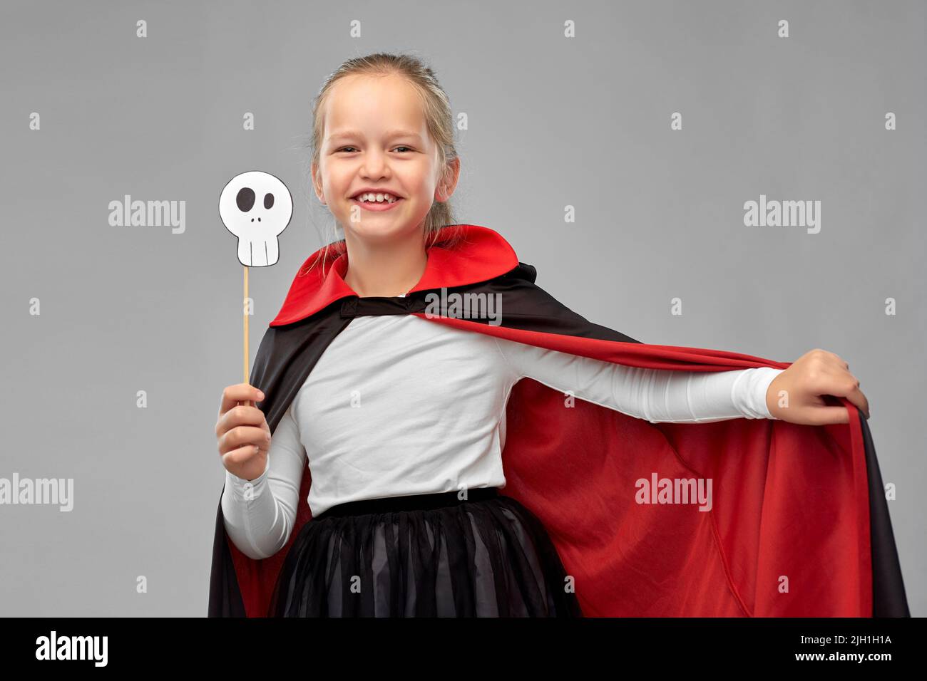 girl in costume of dracula with cape on halloween Stock Photo - Alamy