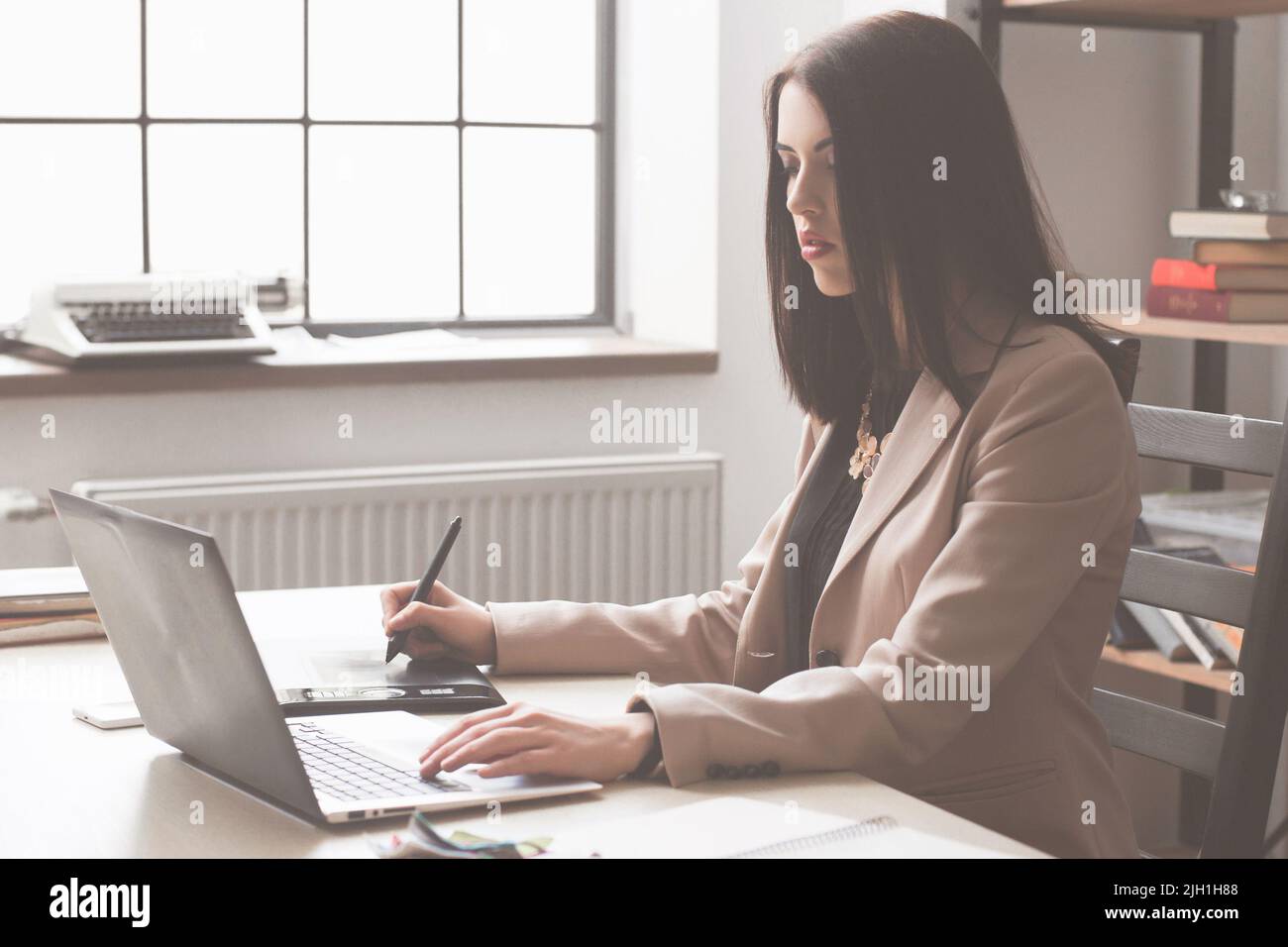 Artist drawing something on graphic tablet Stock Photo - Alamy