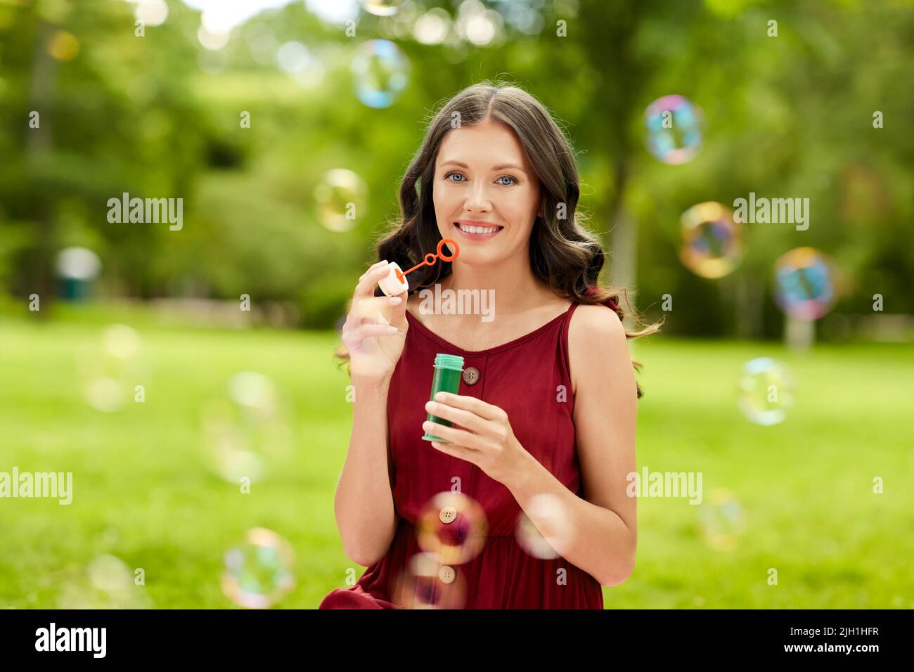 Beautiful female blowing bubbles hi-res stock photography and images ...