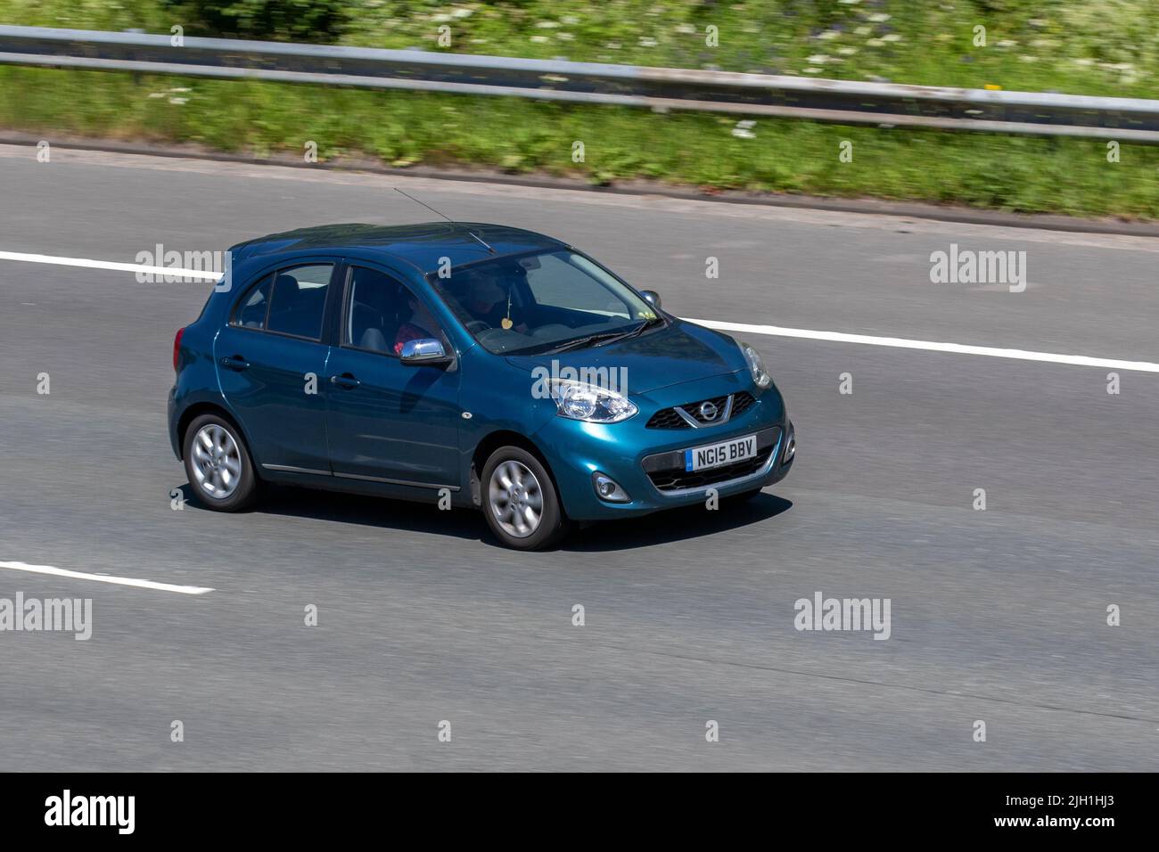 2015 blue Nissan Micra Acenta 1198cc 5 speed manual; travelling on the ...