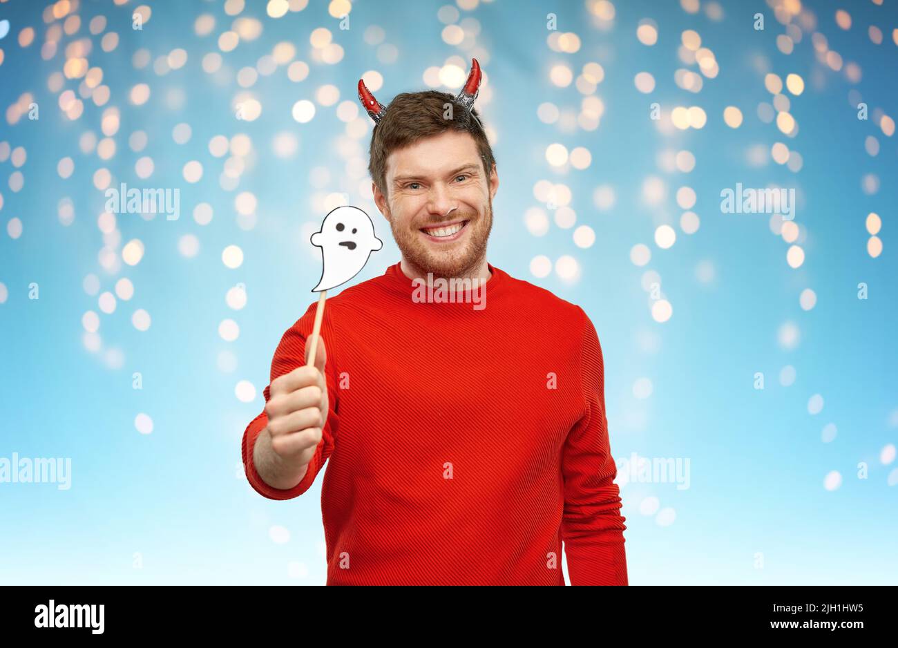happy man in halloween costume of devil over grey Stock Photo - Alamy
