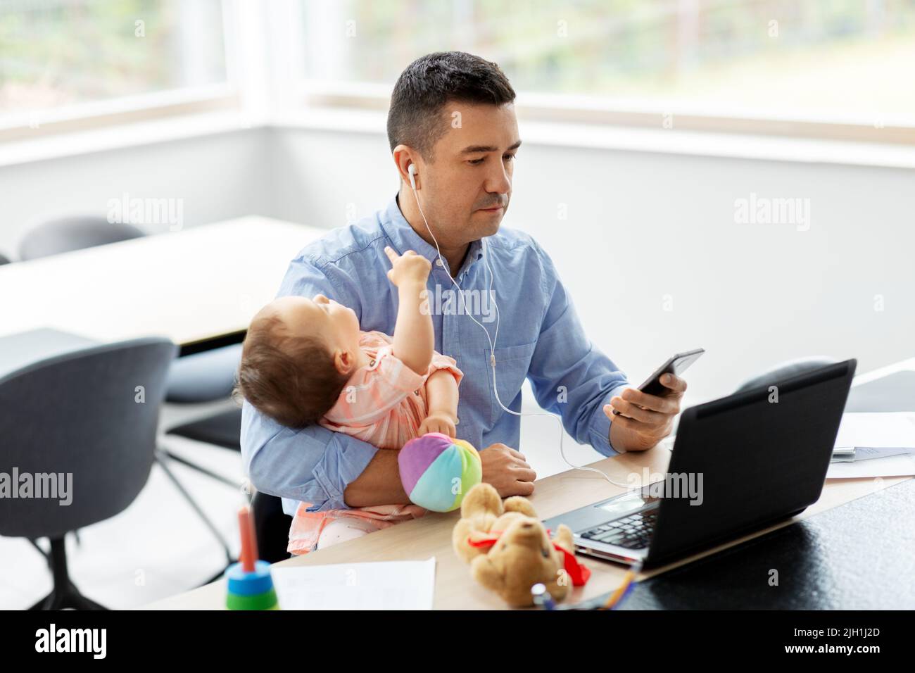 Working father child laptop phone hi-res stock photography and images ...