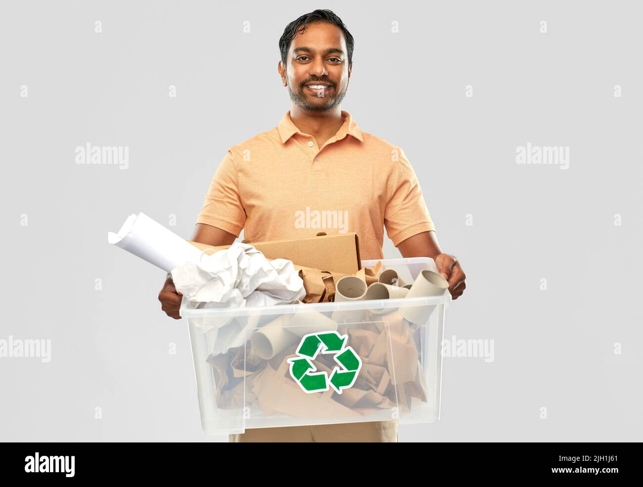 smiling young indian man sorting paper waste Stock Photo - Alamy