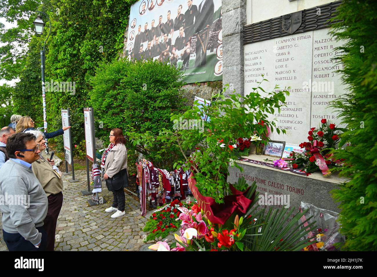 The people near a gravestone in memory of the legendary Grande Torino ...