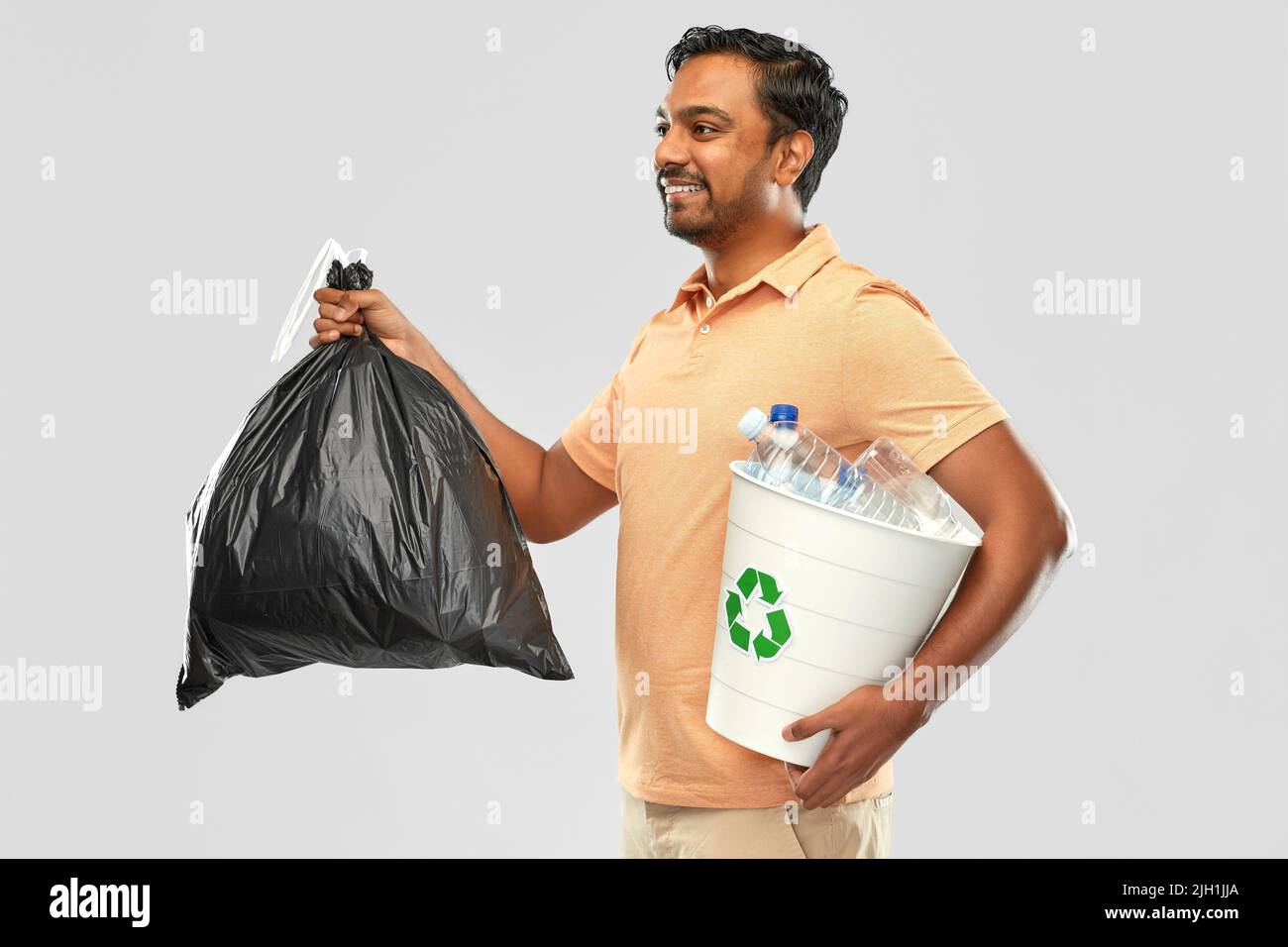 smiling indian man sorting paper and plastic waste Stock Photo - Alamy