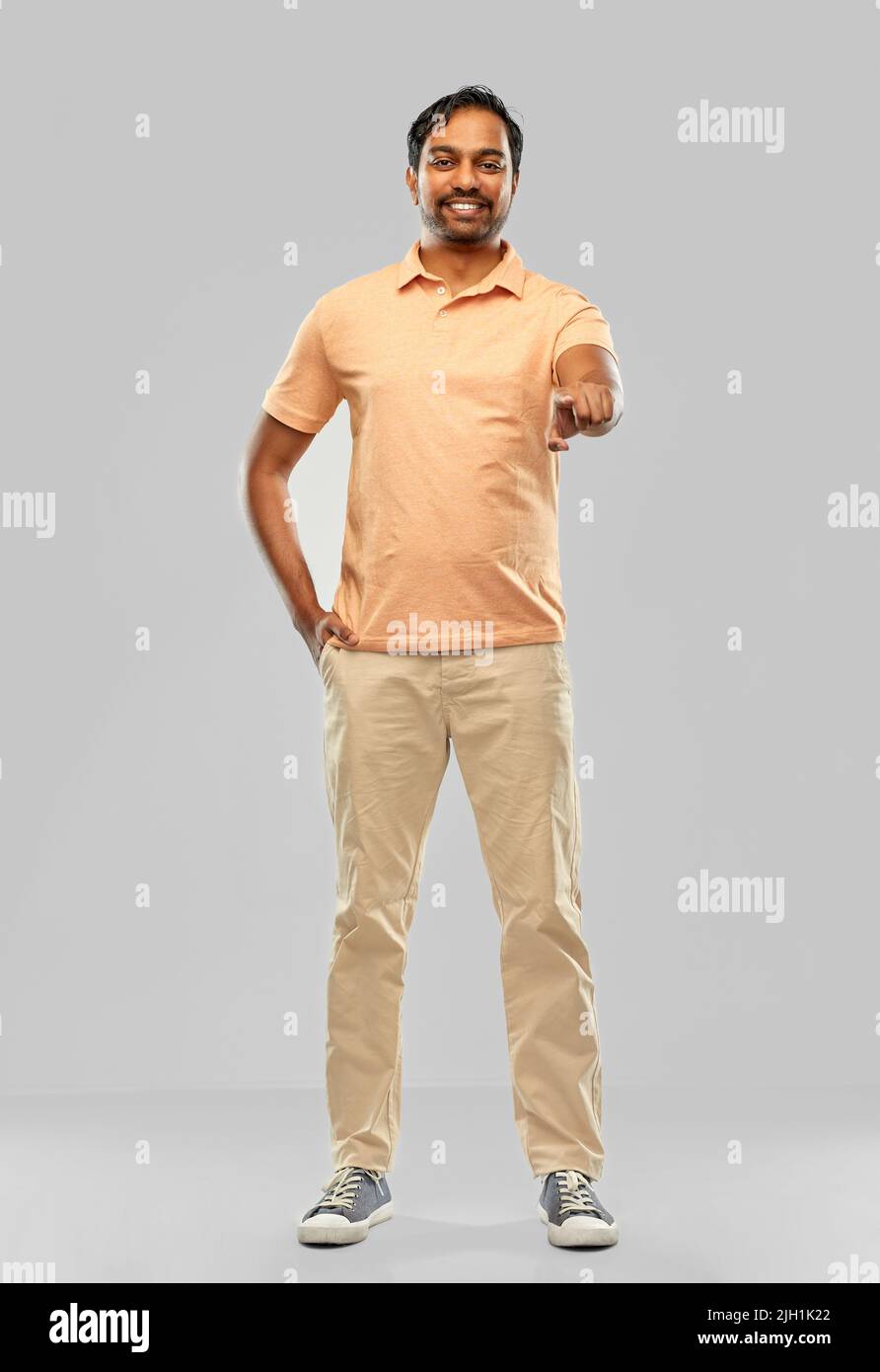 smiling indian man pointing fingers at you Stock Photo - Alamy