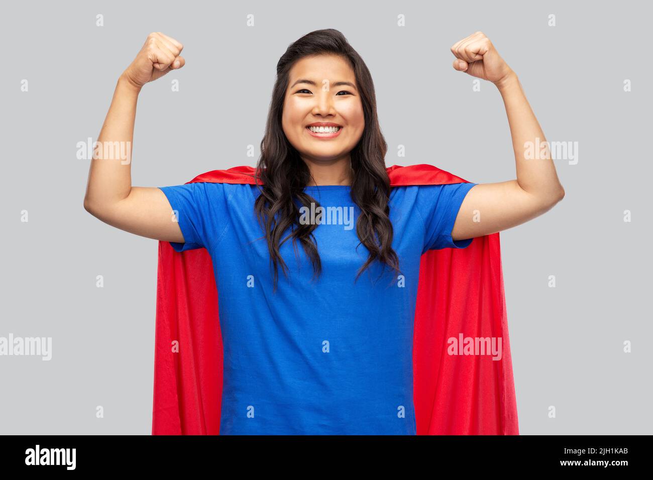 happy asian woman in red superhero cape Stock Photo - Alamy