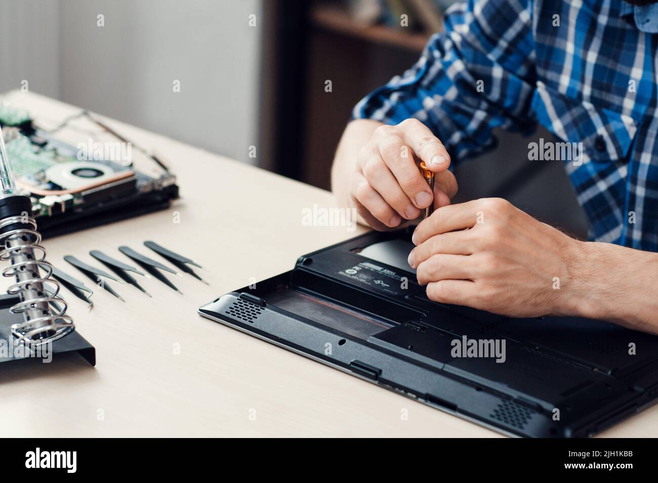Laptop disassembling in repair shop, close-up Stock Photo - Alamy