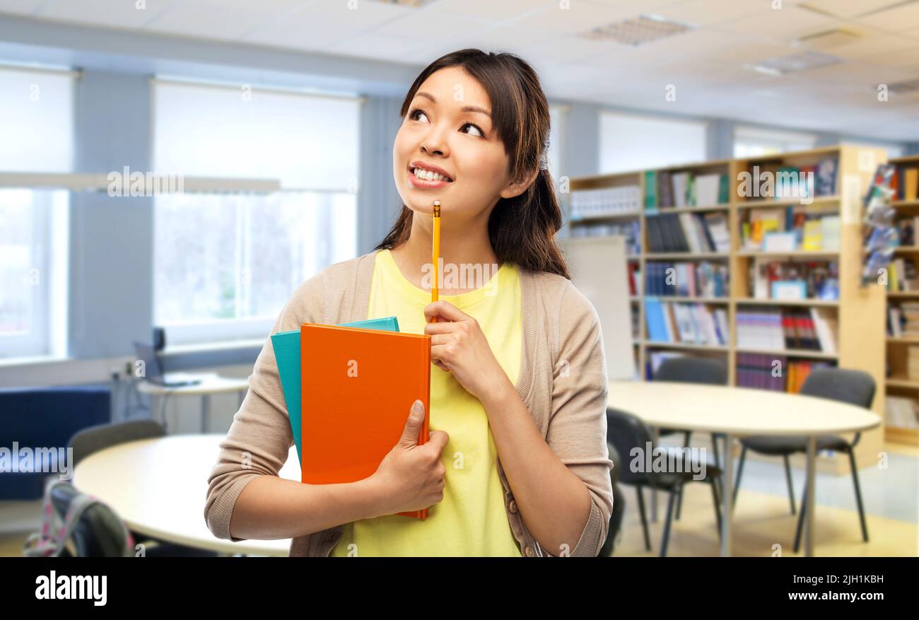 asian student woman with books at library Stock Photo - Alamy