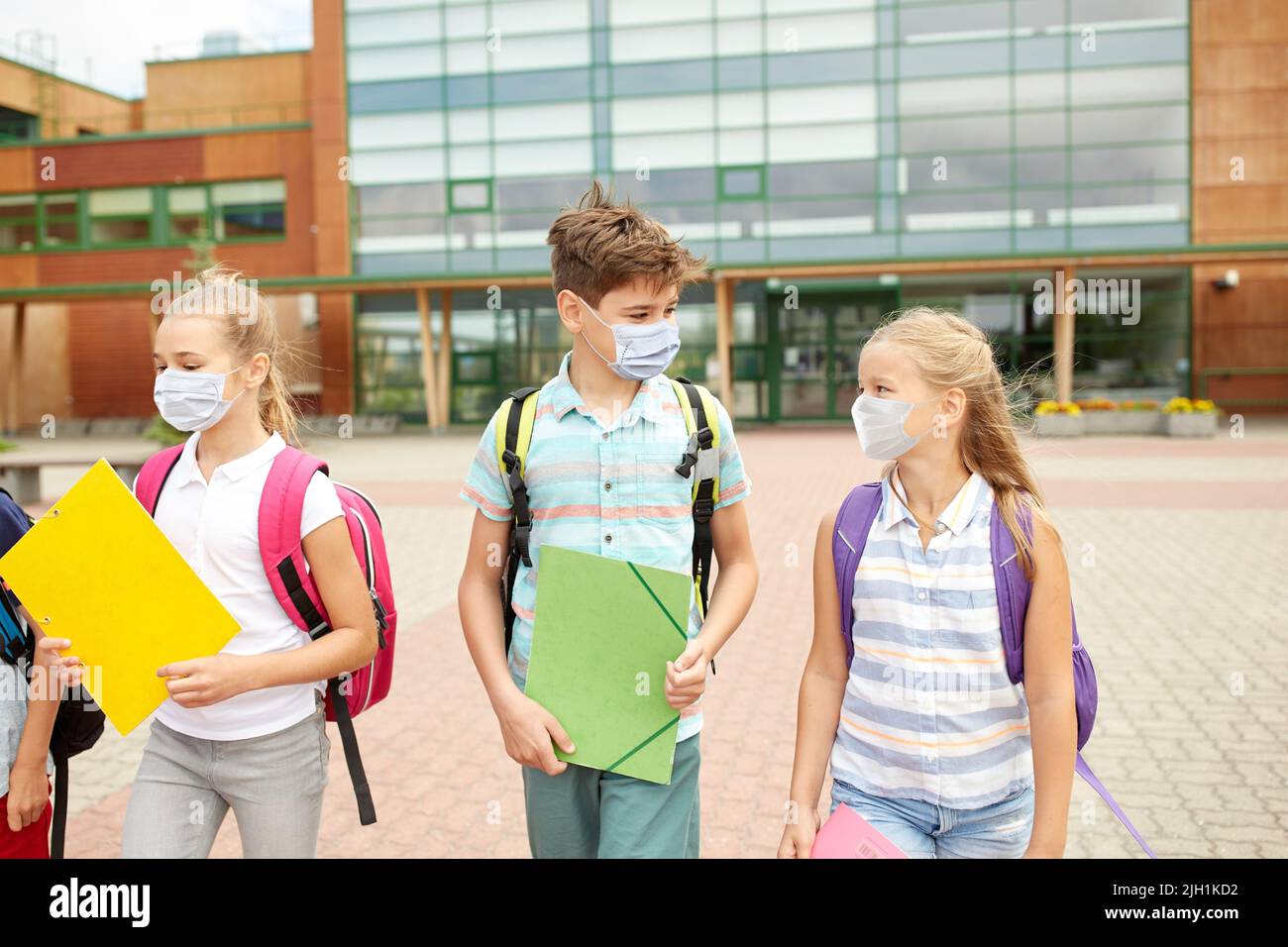 group of elementary school students in masks Stock Photo - Alamy