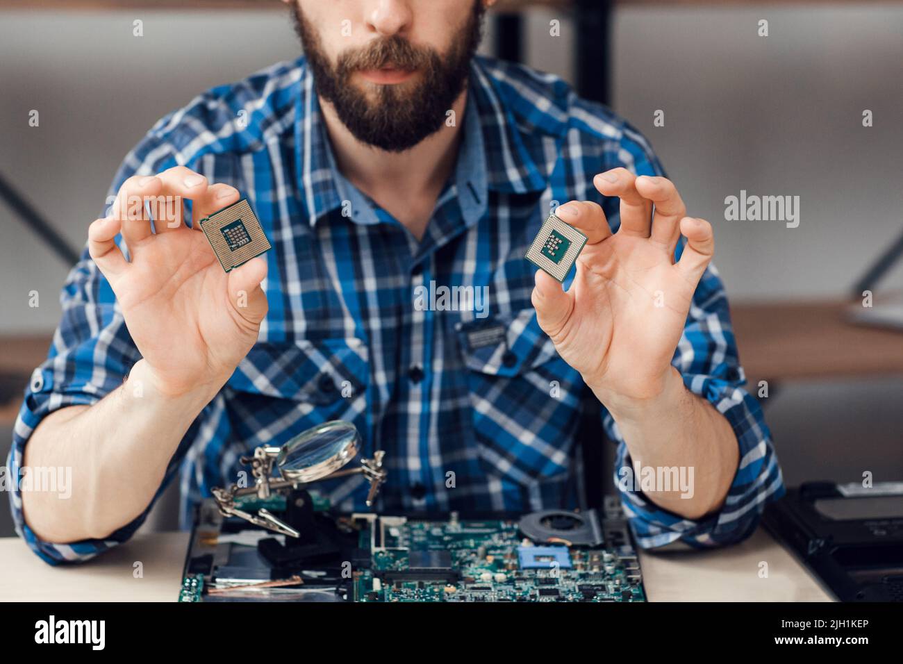 Microchips and hand hi-res stock photography and images - Alamy