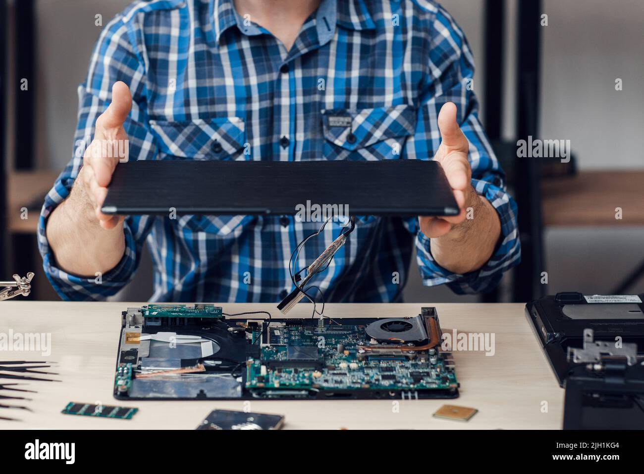 Laptop disassembling at electronic repair shop Stock Photo - Alamy