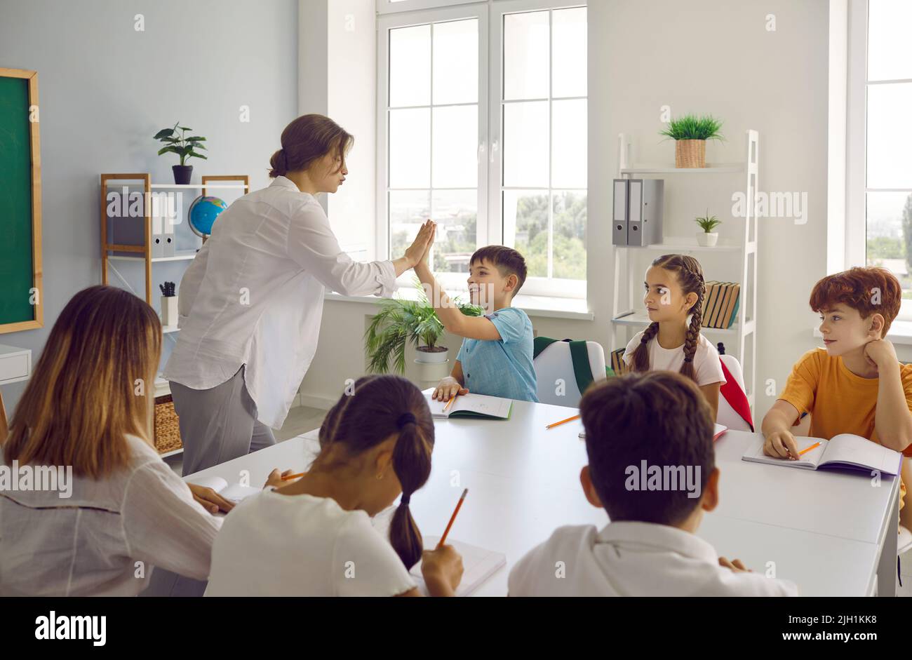 Boy teacher greeting hi-res stock photography and images - Alamy