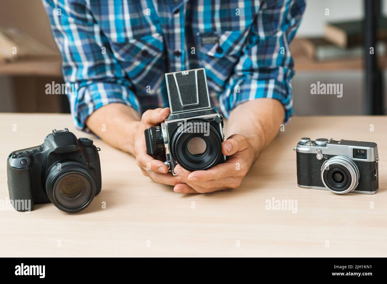 Man holding film camera hi-res stock photography and images - Alamy