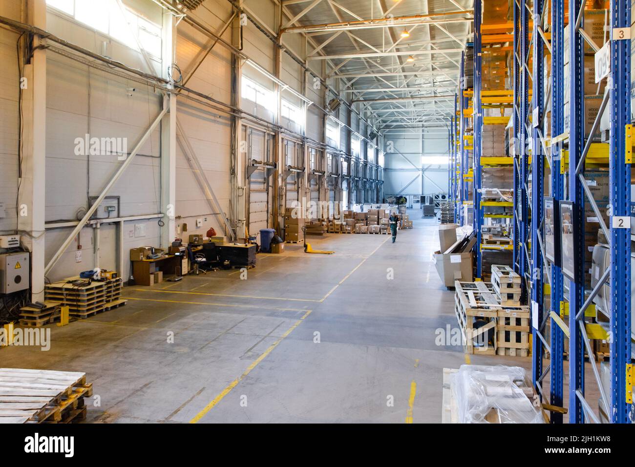 Interior of a modern warehouse storage with rows and goods boxes on ...