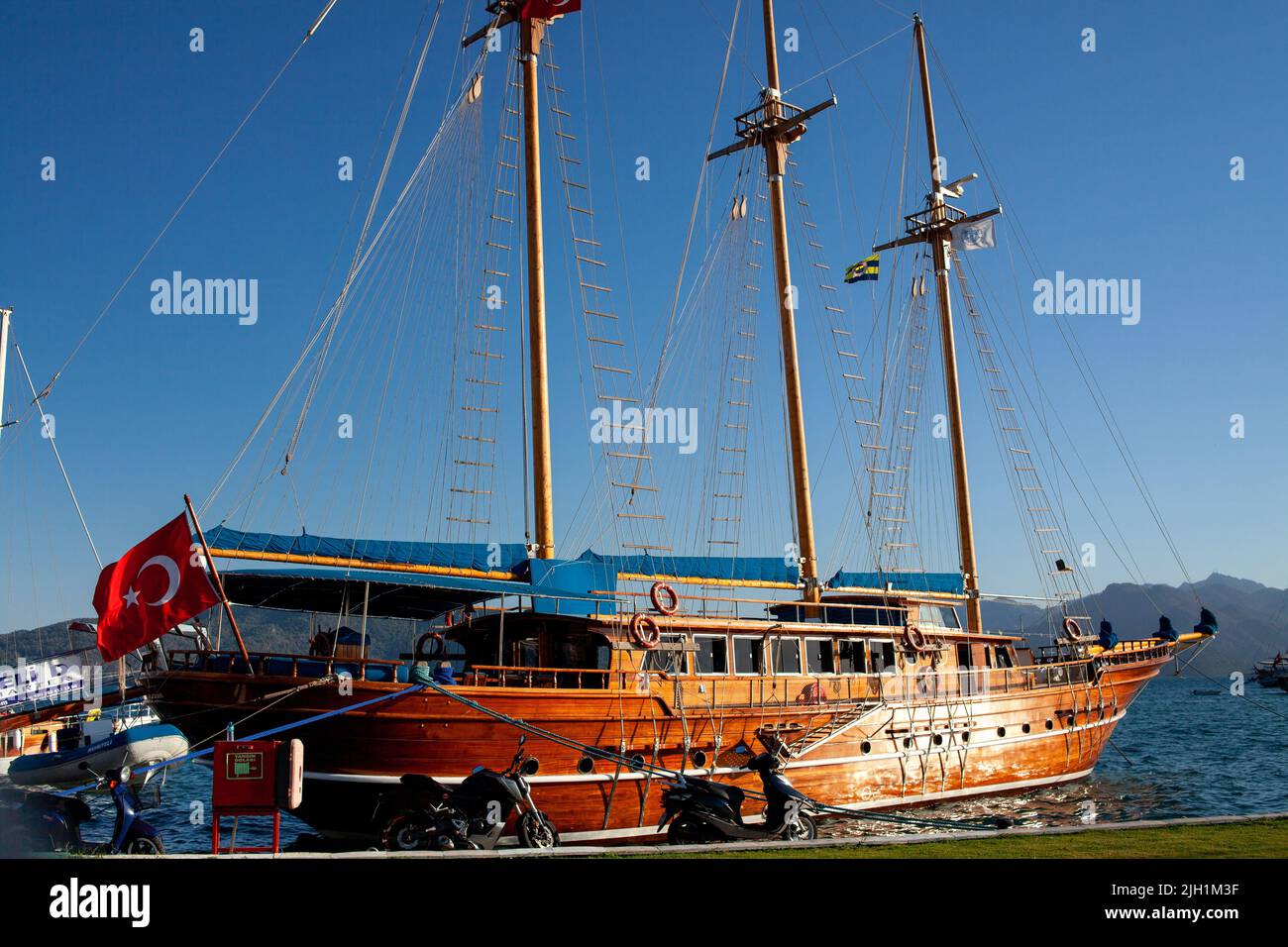 Pleasure yacht in the port. Tourist ship with people on board with ...