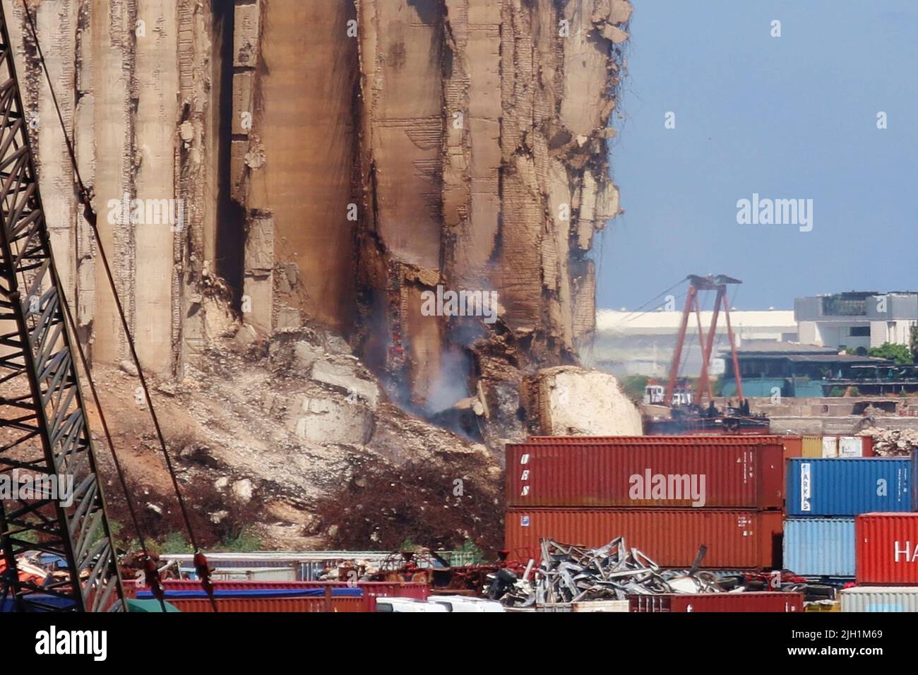 Smoke and fire come out from ravaged corn silos at the port of Beirut ...