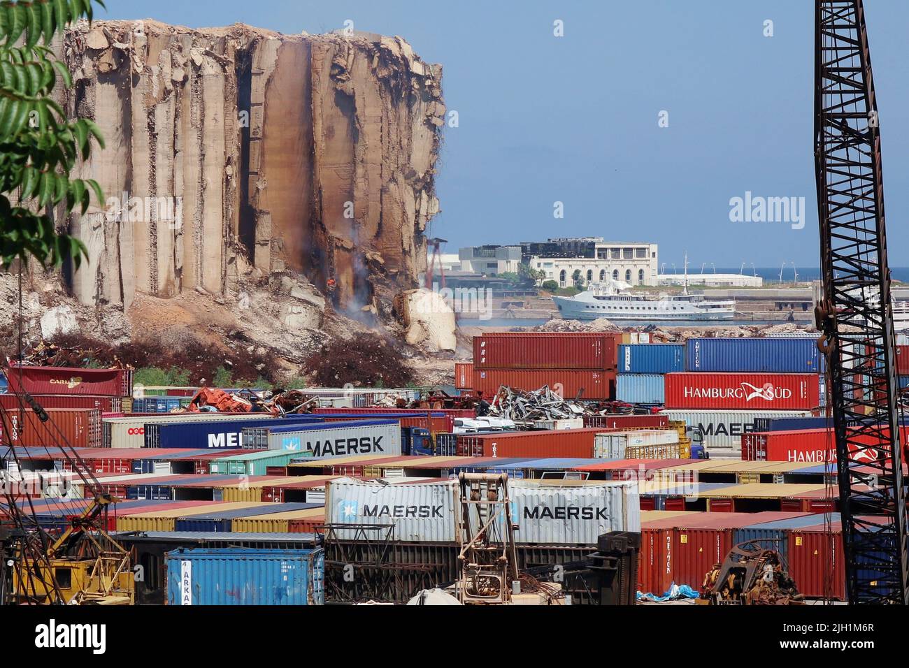 Smoke and fire come out from ravaged corn silos at the port of Beirut ...