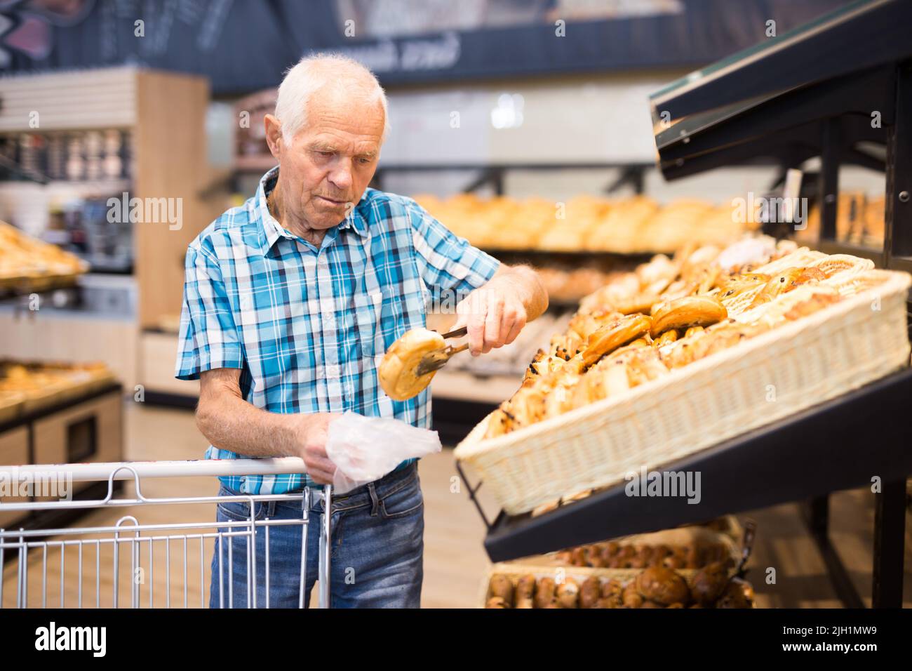 Old man buying bread in hi-res stock photography and images - Alamy