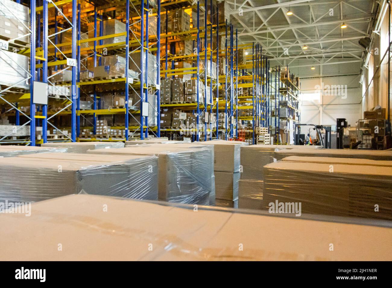 Group of boxes in storehouse. Pallets with carton boxes. Interior of a ...
