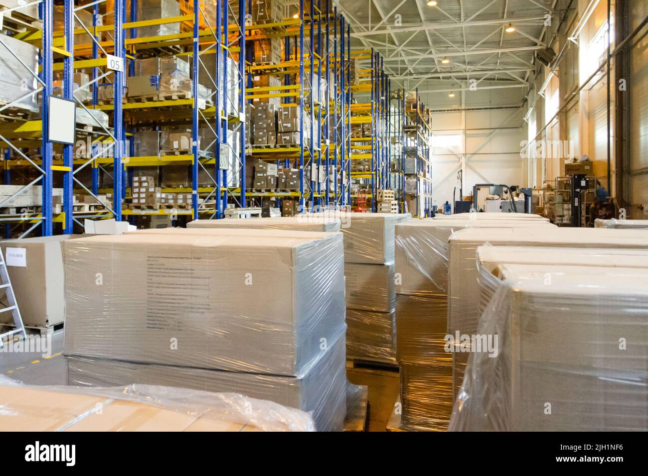 Group of boxes in storehouse. Pallets with carton boxes. Interior of a ...